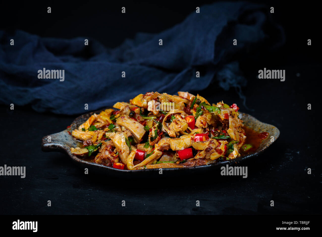 drooling chicken, stick chicken Stock Photo - Alamy