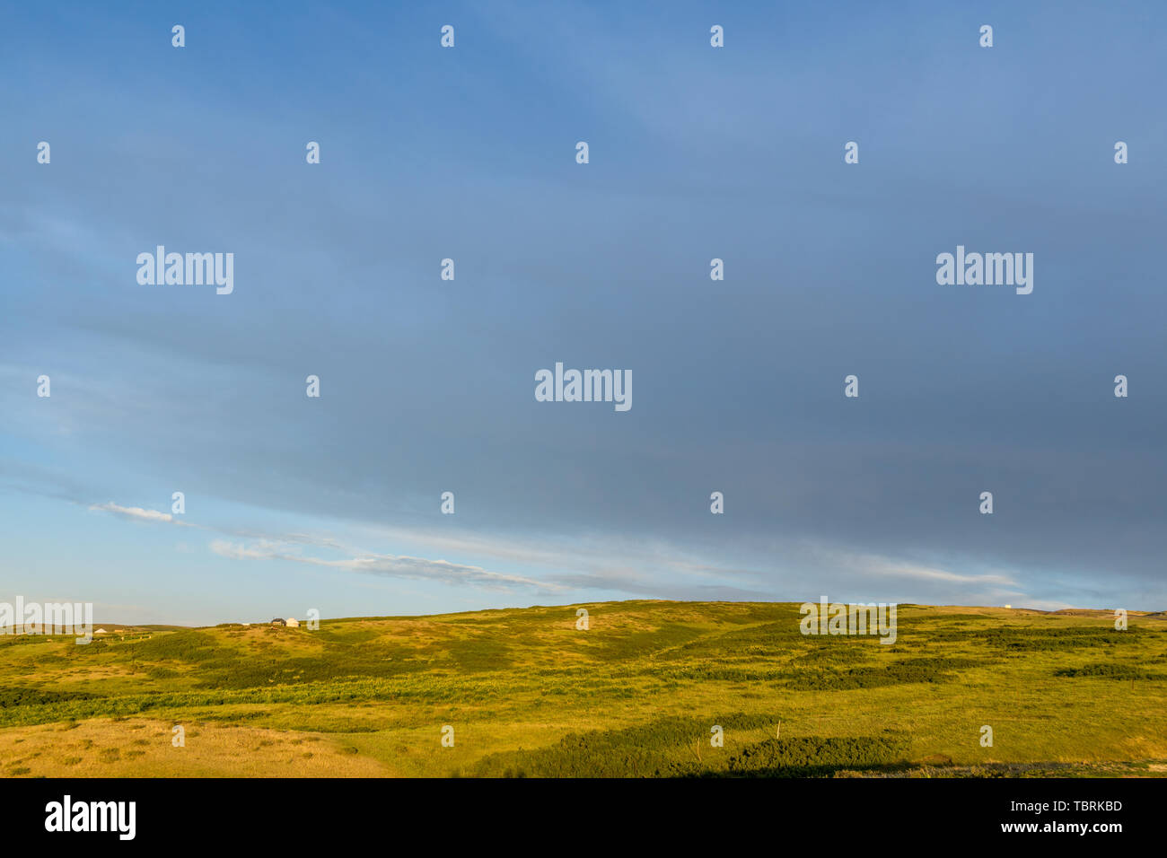 Hillside prairie villages under cloudy clouds Stock Photo - Alamy