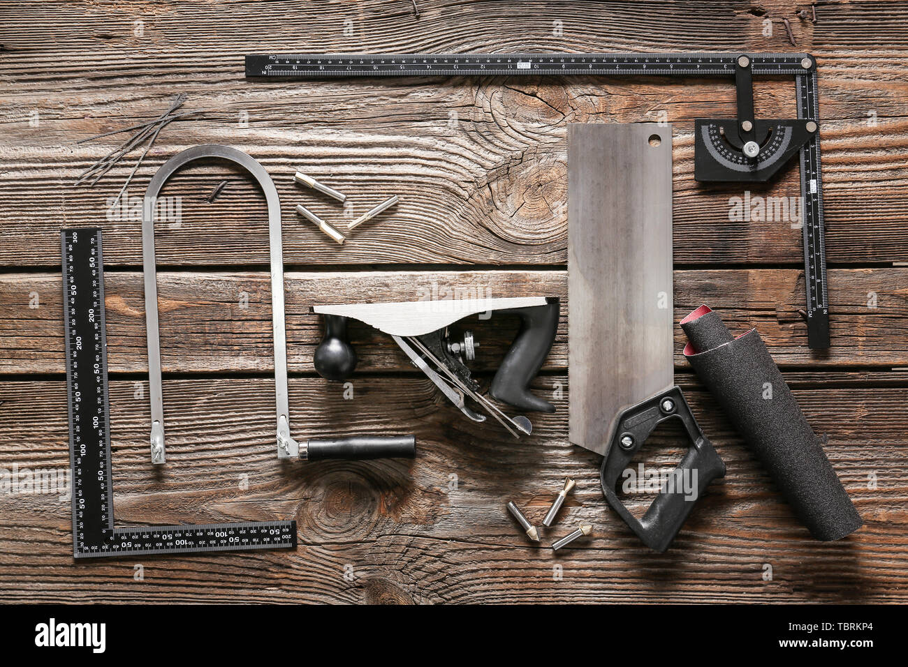 Set of carpenter's tools on wooden background Stock Photo - Alamy