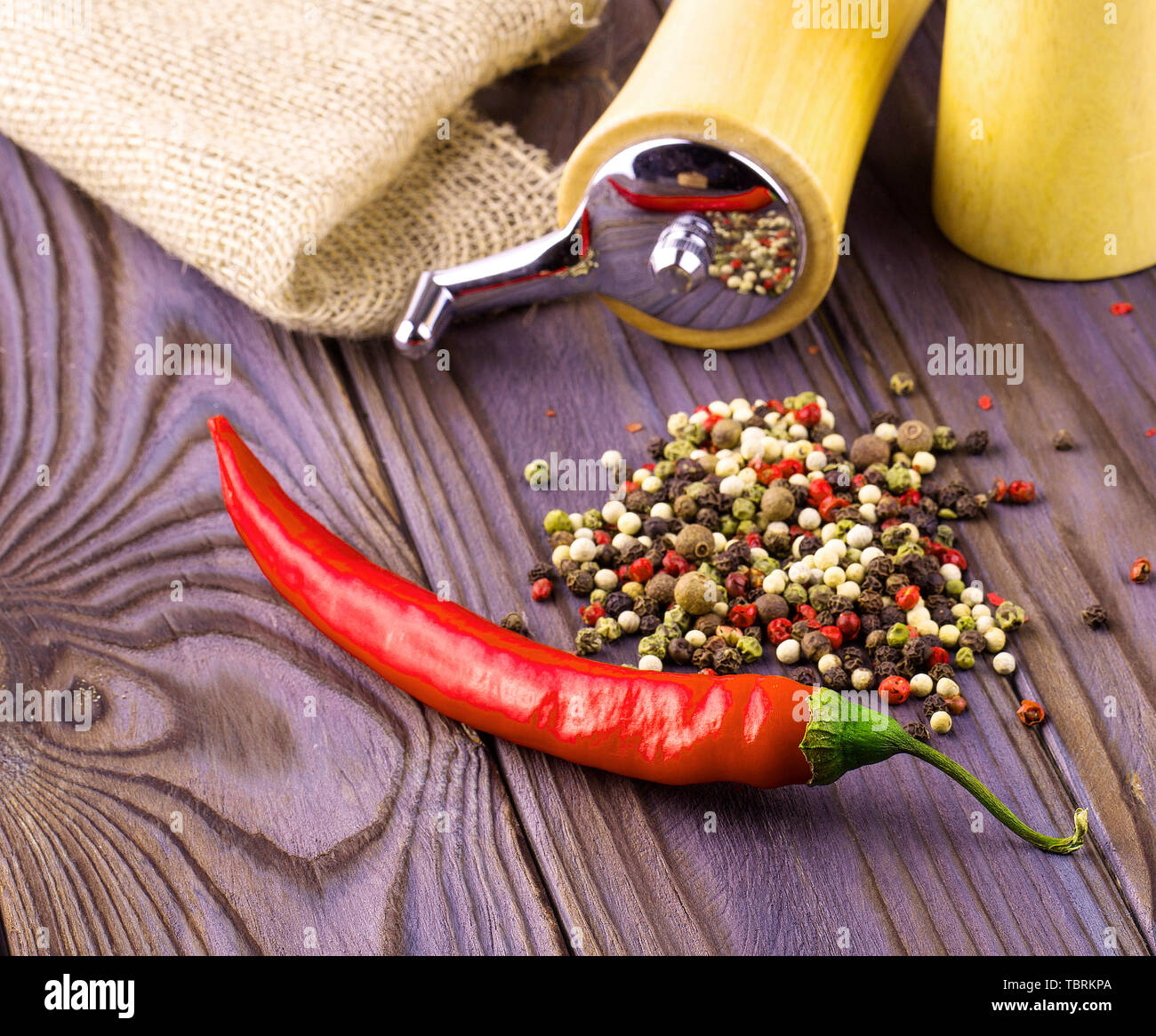 The black pepper corns, red hot chili pepper and Black pepper Powder on ...