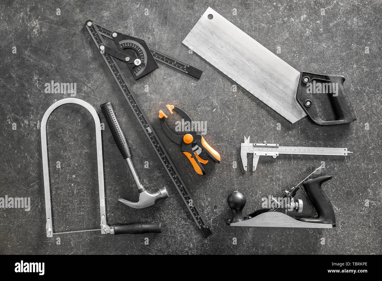 Set of carpenter's tools on grey background Stock Photo - Alamy