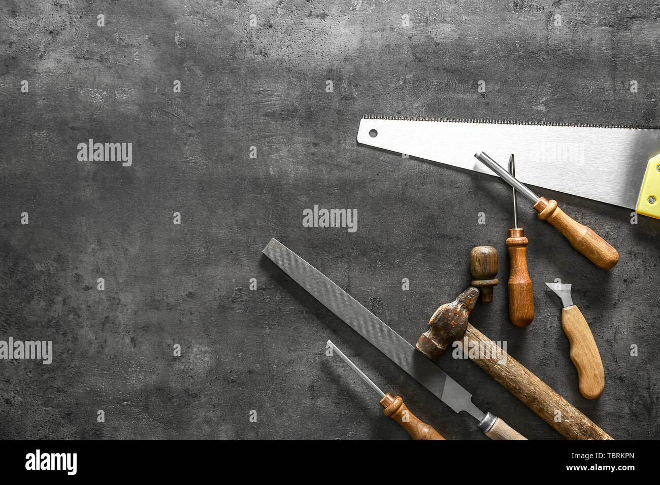 Set of carpenter's tools on grey background Stock Photo - Alamy