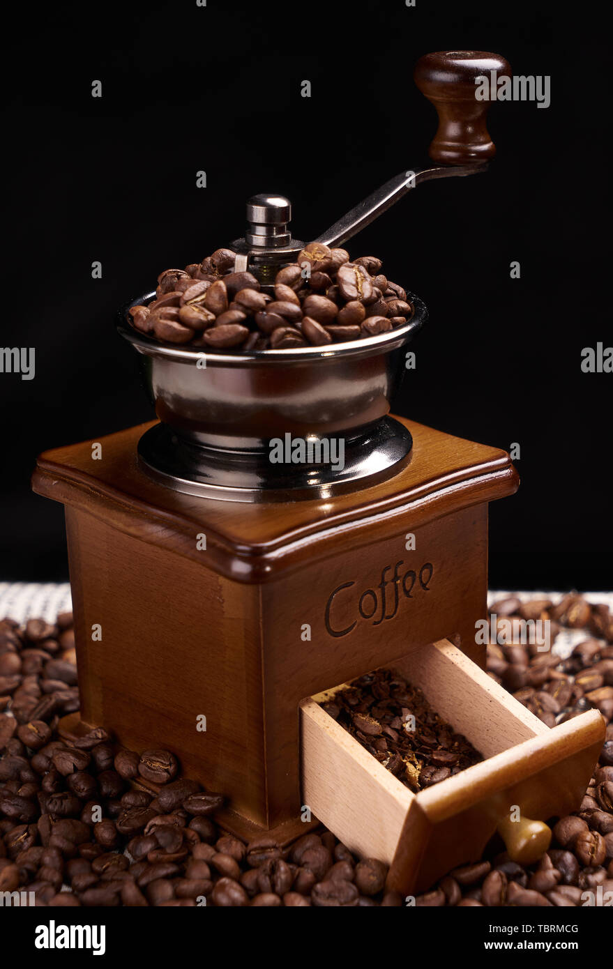Handmade bean grinders and coffee beans Stock Photo - Alamy