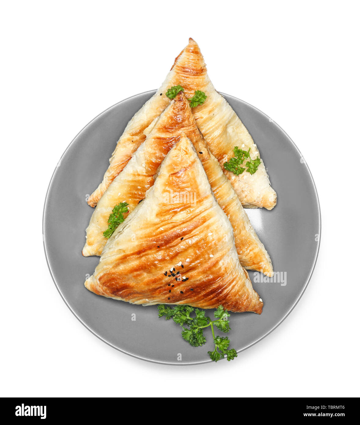Plate with delicious samosas on white background Stock Photo - Alamy