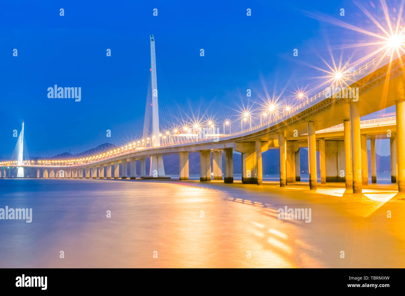 Cross-sea bridge under the sunset Stock Photo - Alamy