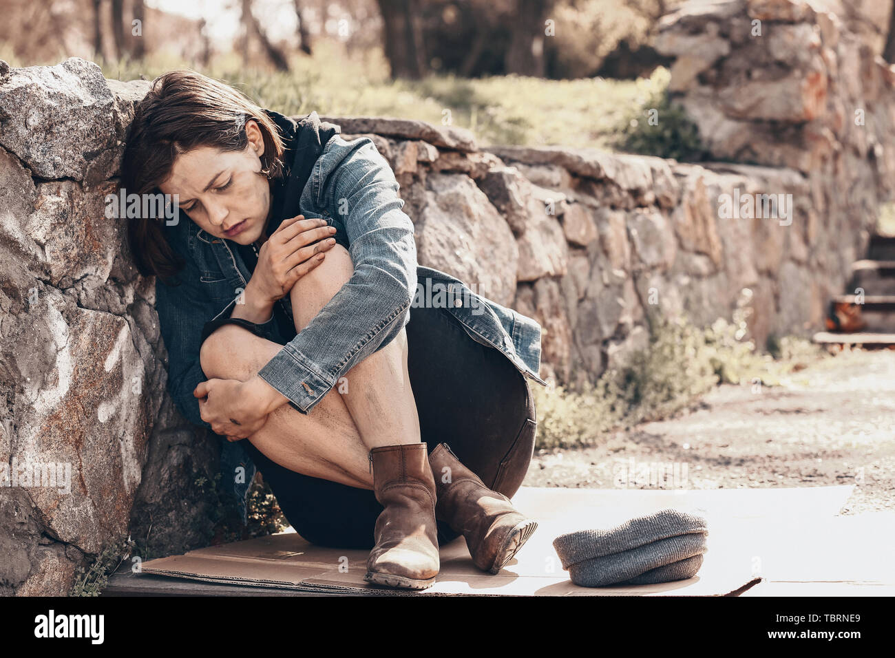 Poor homeless woman outdoors Stock Photo - Alamy
