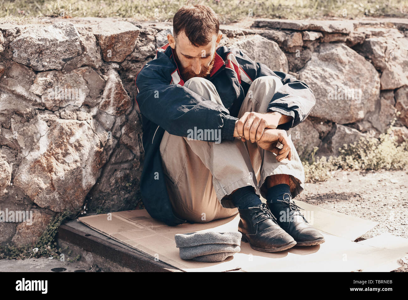 Poor homeless man outdoors Stock Photo - Alamy
