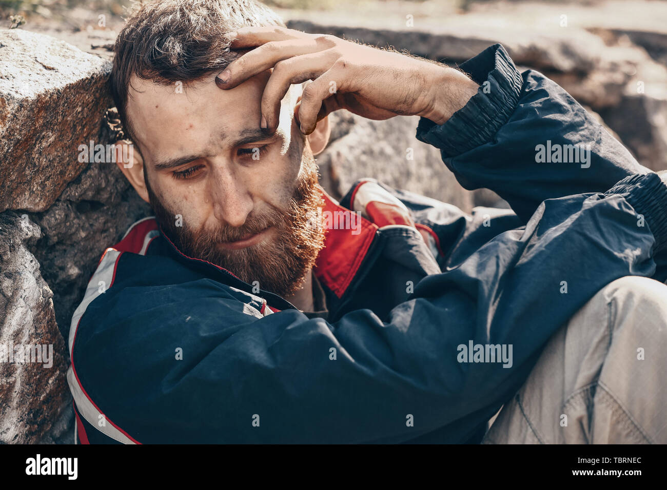 Portrait of sad homeless man outdoors Stock Photo - Alamy