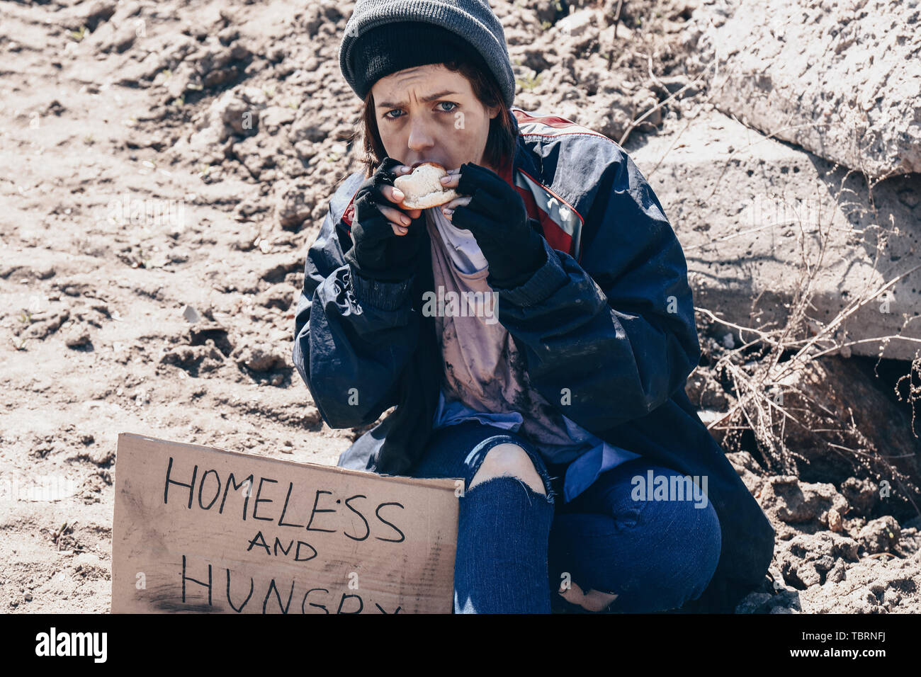 Homeless young woman asking help hi-res stock photography and images ...