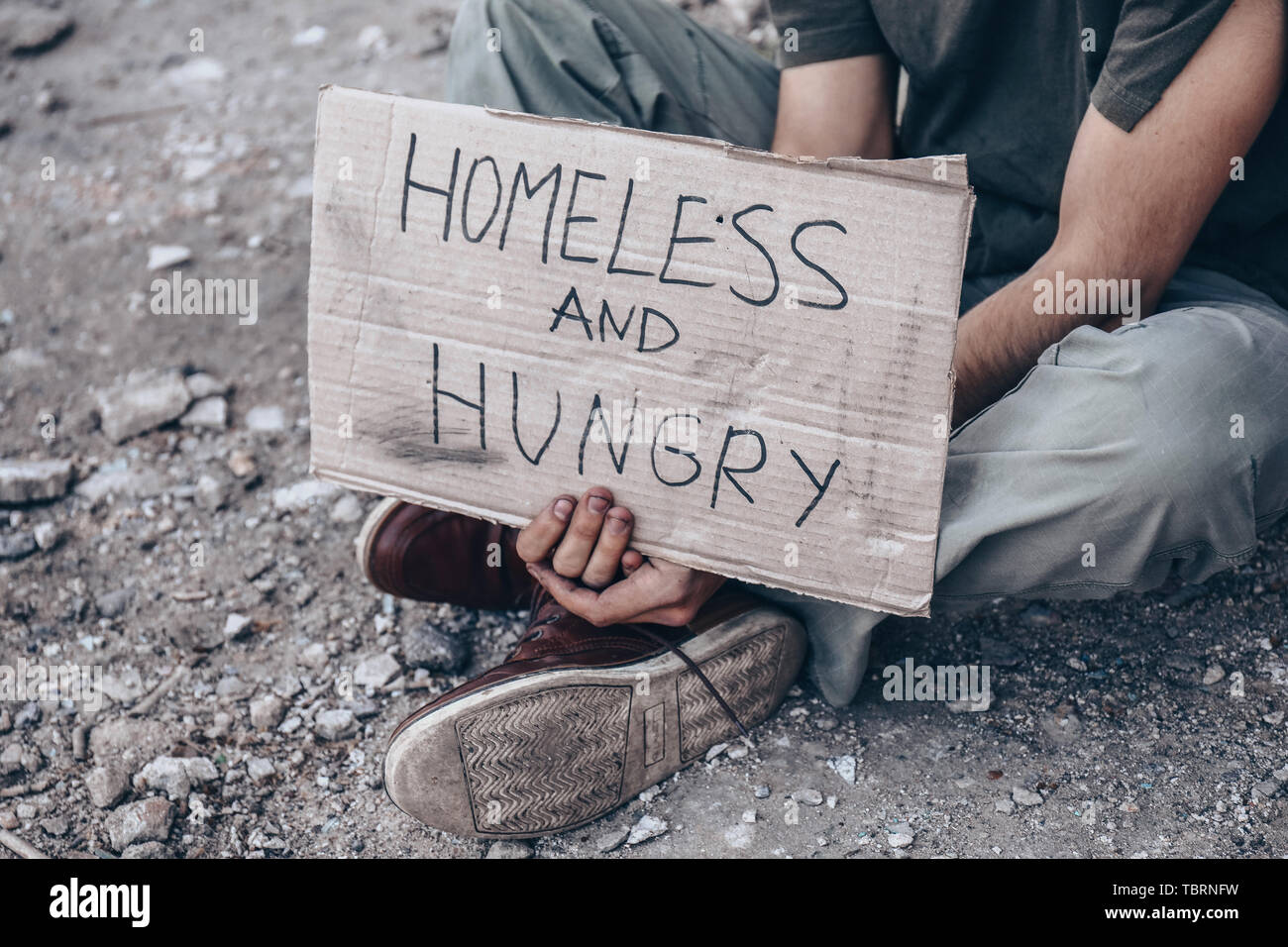 Poor homeless man begging for help outdoors Stock Photo - Alamy