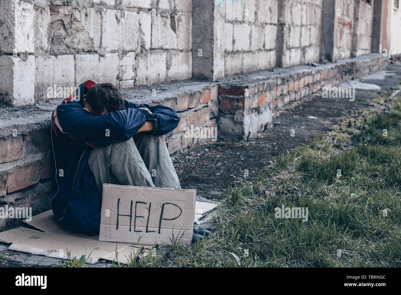 Poor homeless man begging for help outdoors Stock Photo - Alamy