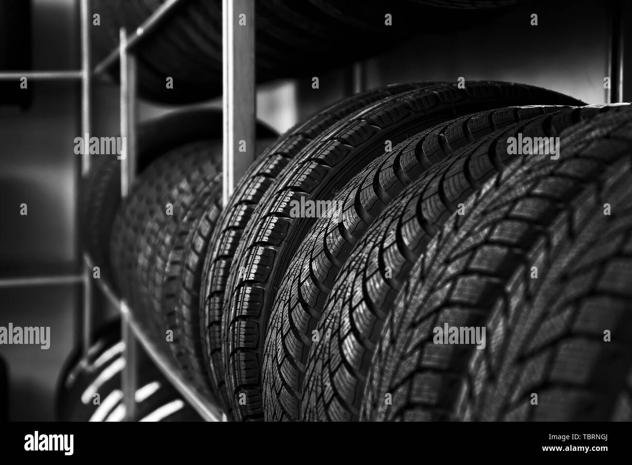 Car tires in automobile store, closeup Stock Photo - Alamy