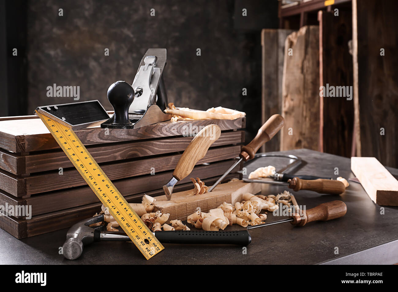 Tools of carpenter on table in workshop Stock Photo - Alamy