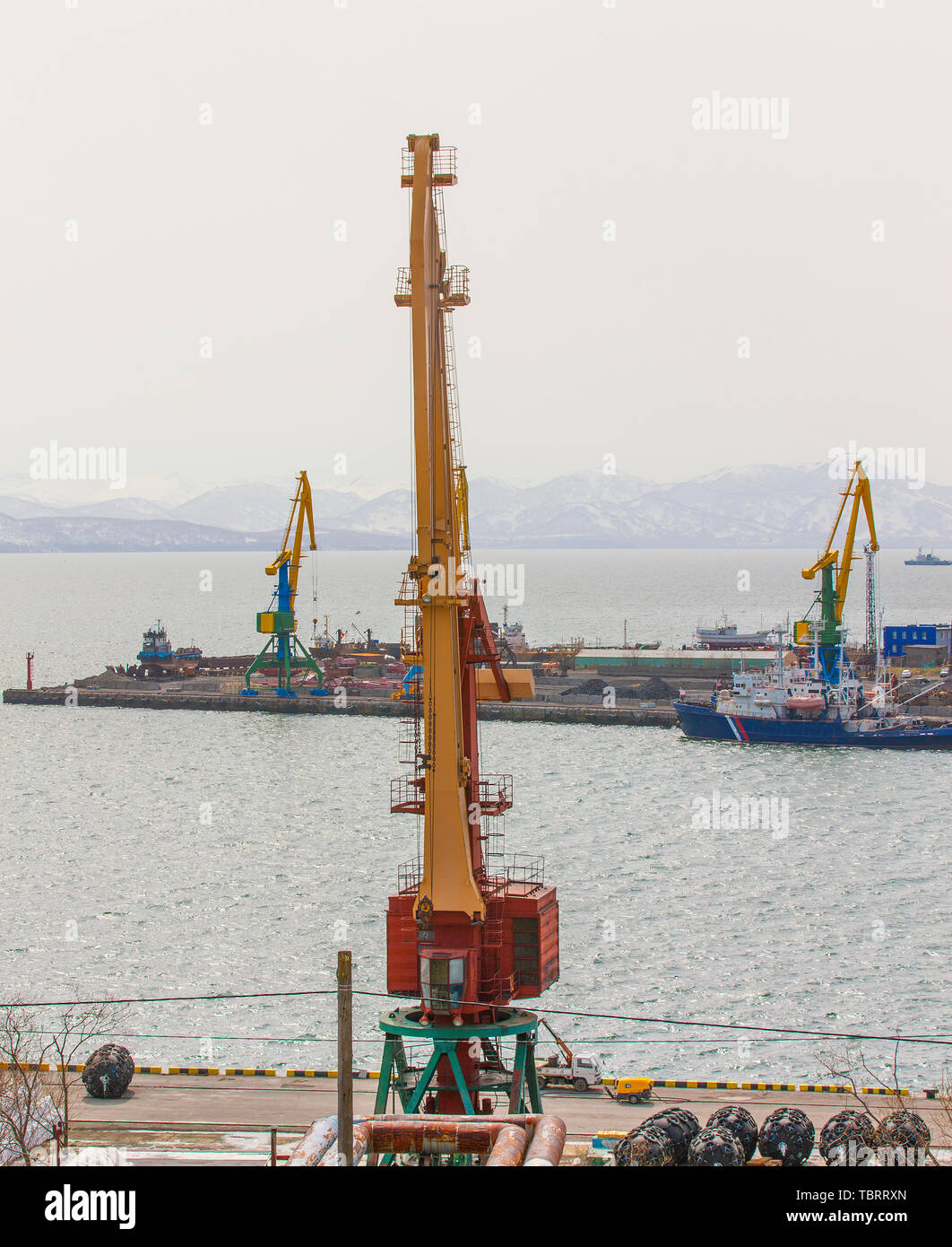 Port cranes and ships on commercial seaport Petropavlovsk-Kamchatsky ...