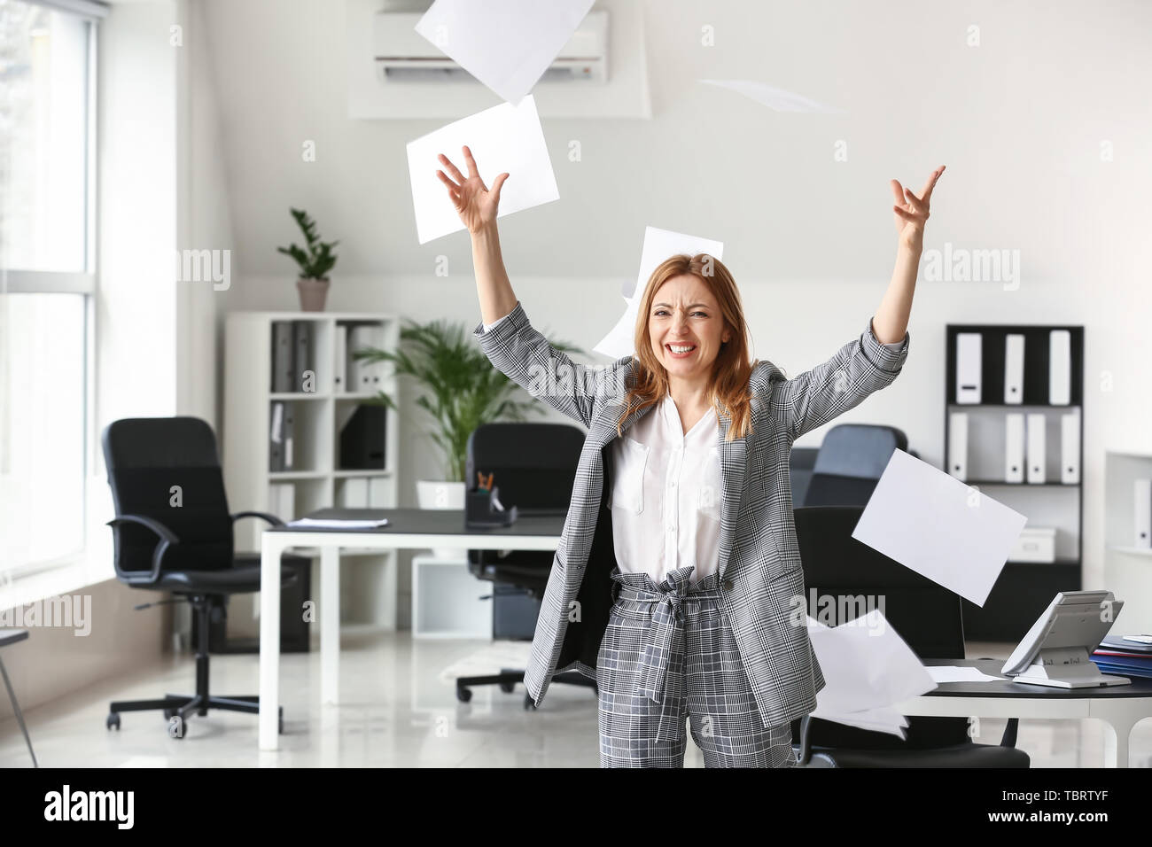 Office lady throwing papers hi-res stock photography and images - Alamy