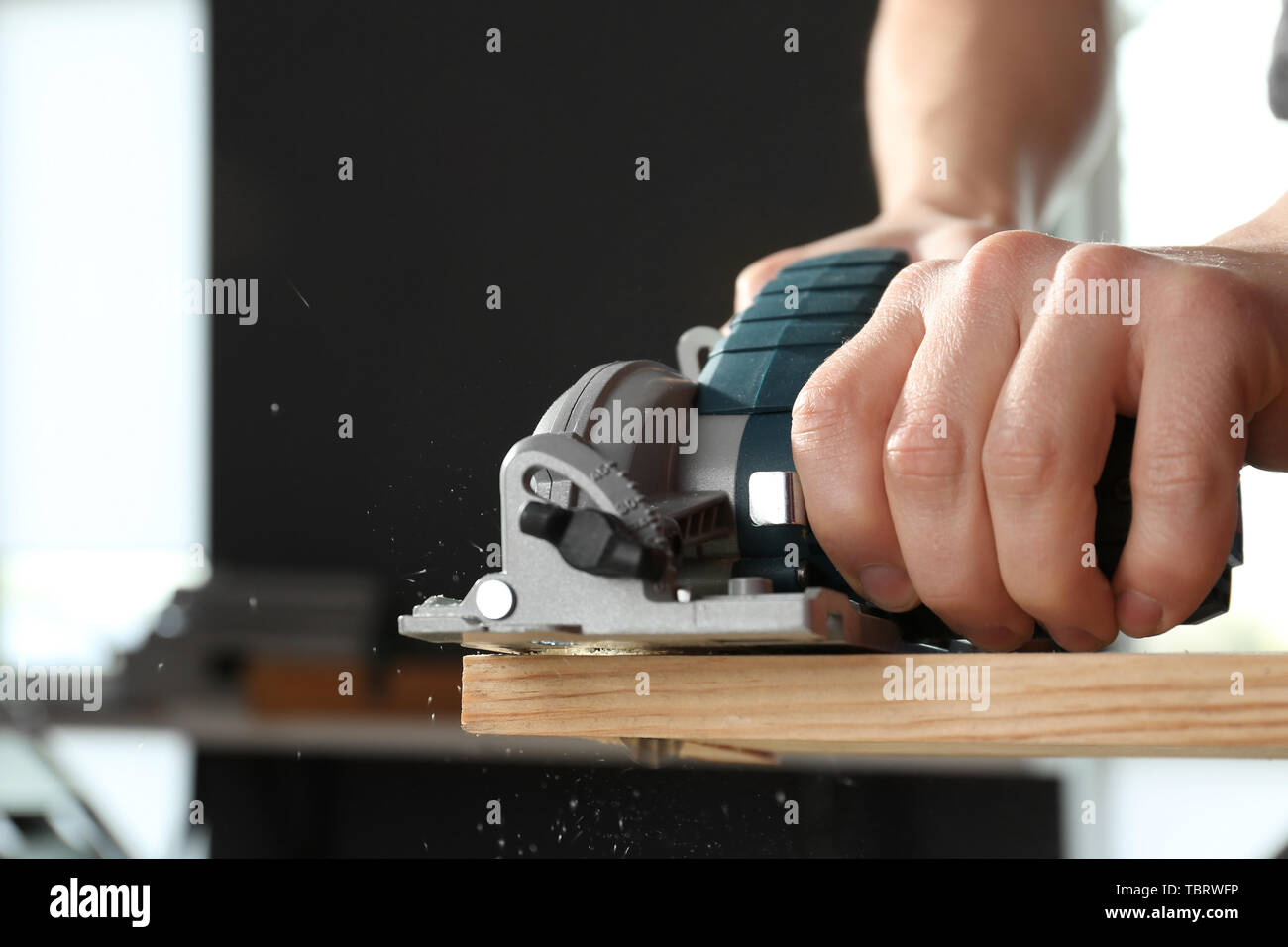 Craftsman holding electric cutter hi-res stock photography and images ...