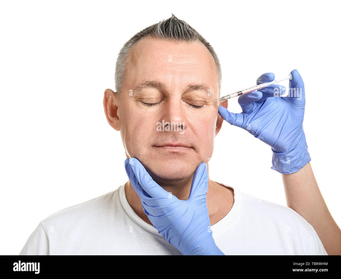 Middle-aged man and hands holding syringe for anti-aging injections on ...