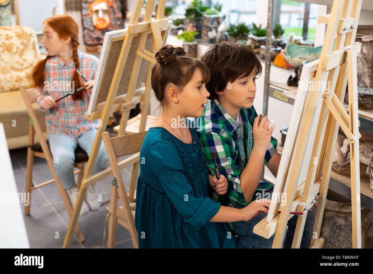 Children feeling excited. Active talented good-looking children feeling ...