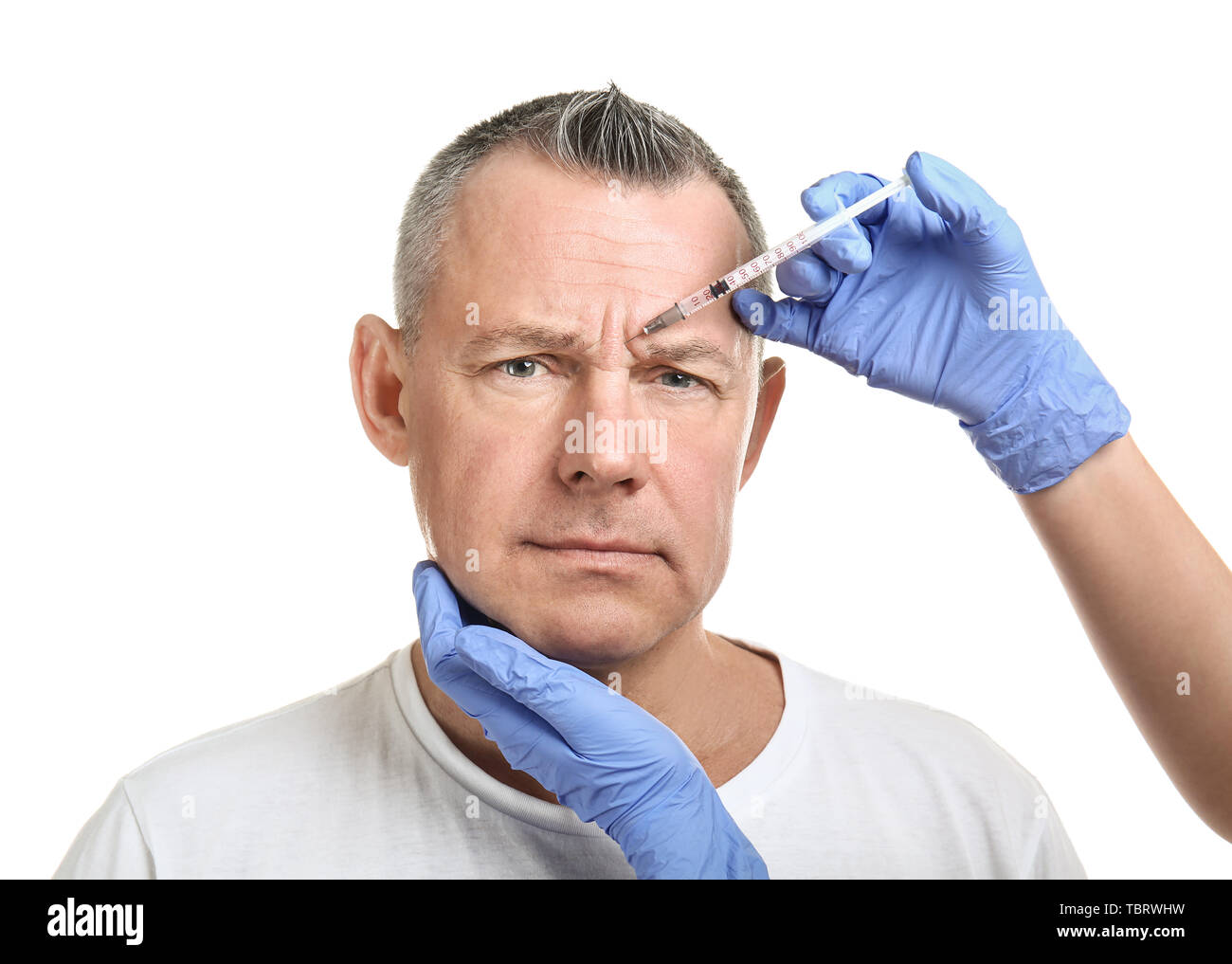 Middle Aged Man And Hands Holding Syringe For Anti Aging Injections On