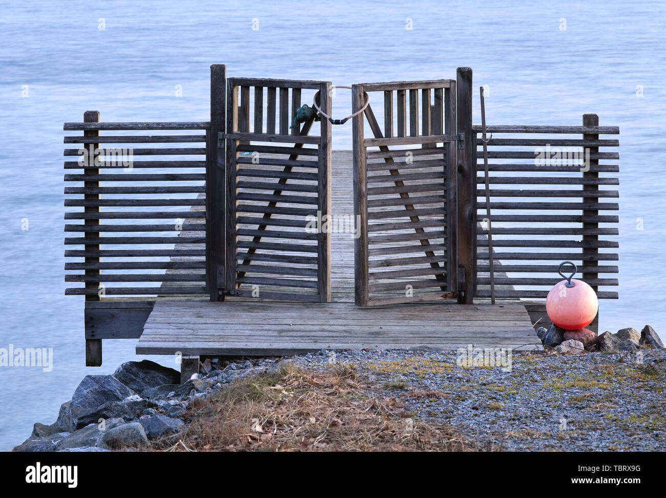 Locked wooden gate to a wooden jetty in Styrmansholmen, Karlsudd, near ...