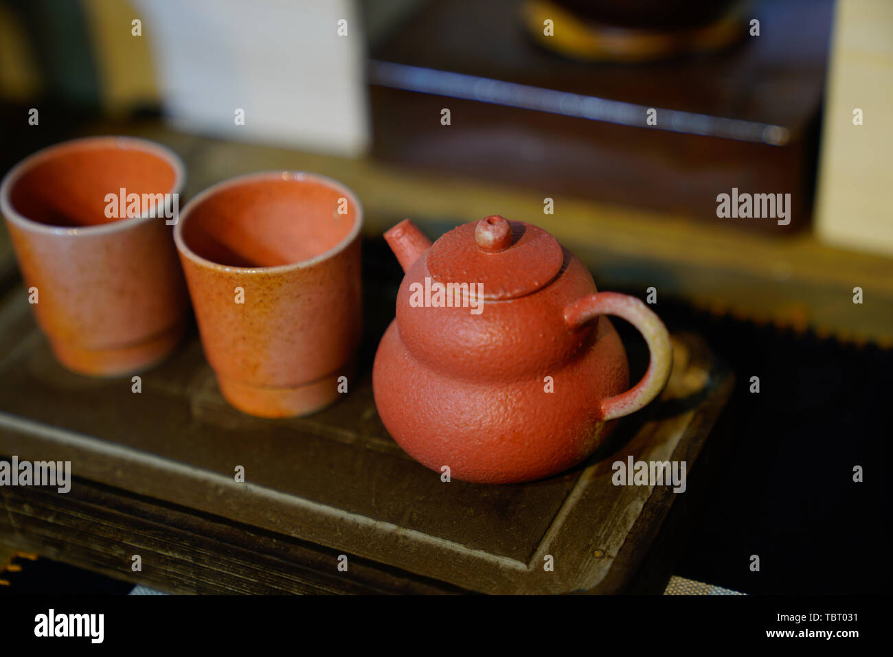 Red mud teapot Stock Photo - Alamy