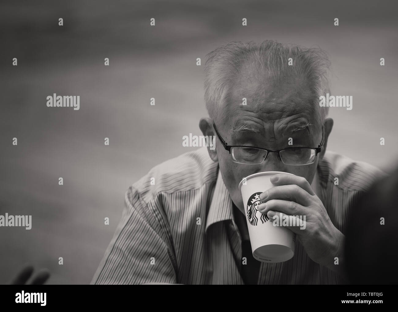 Woman drinking starbucks hi-res stock photography and images - Alamy