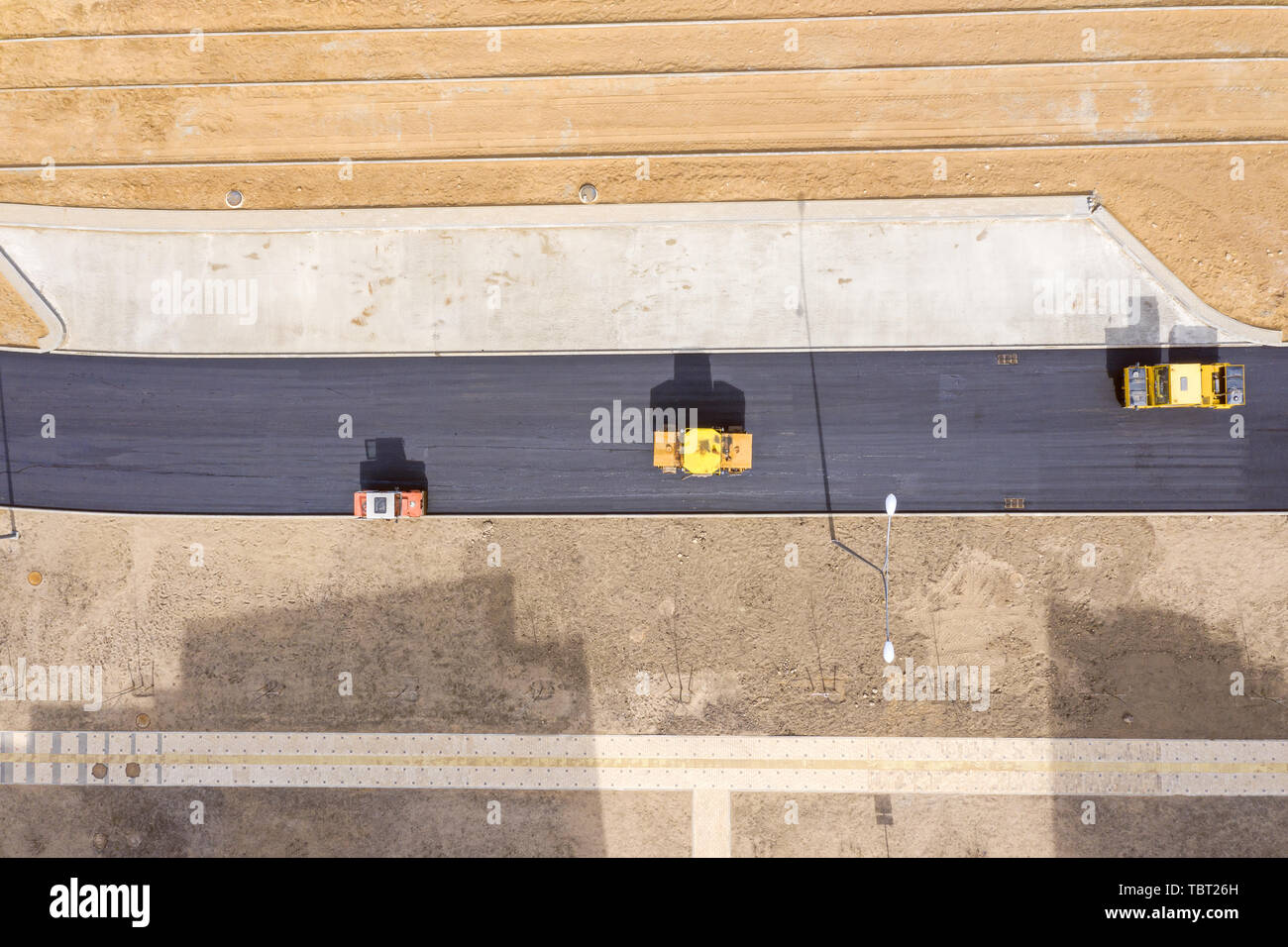 Asphalt paver laying bitumen rollers hi-res stock photography and ...