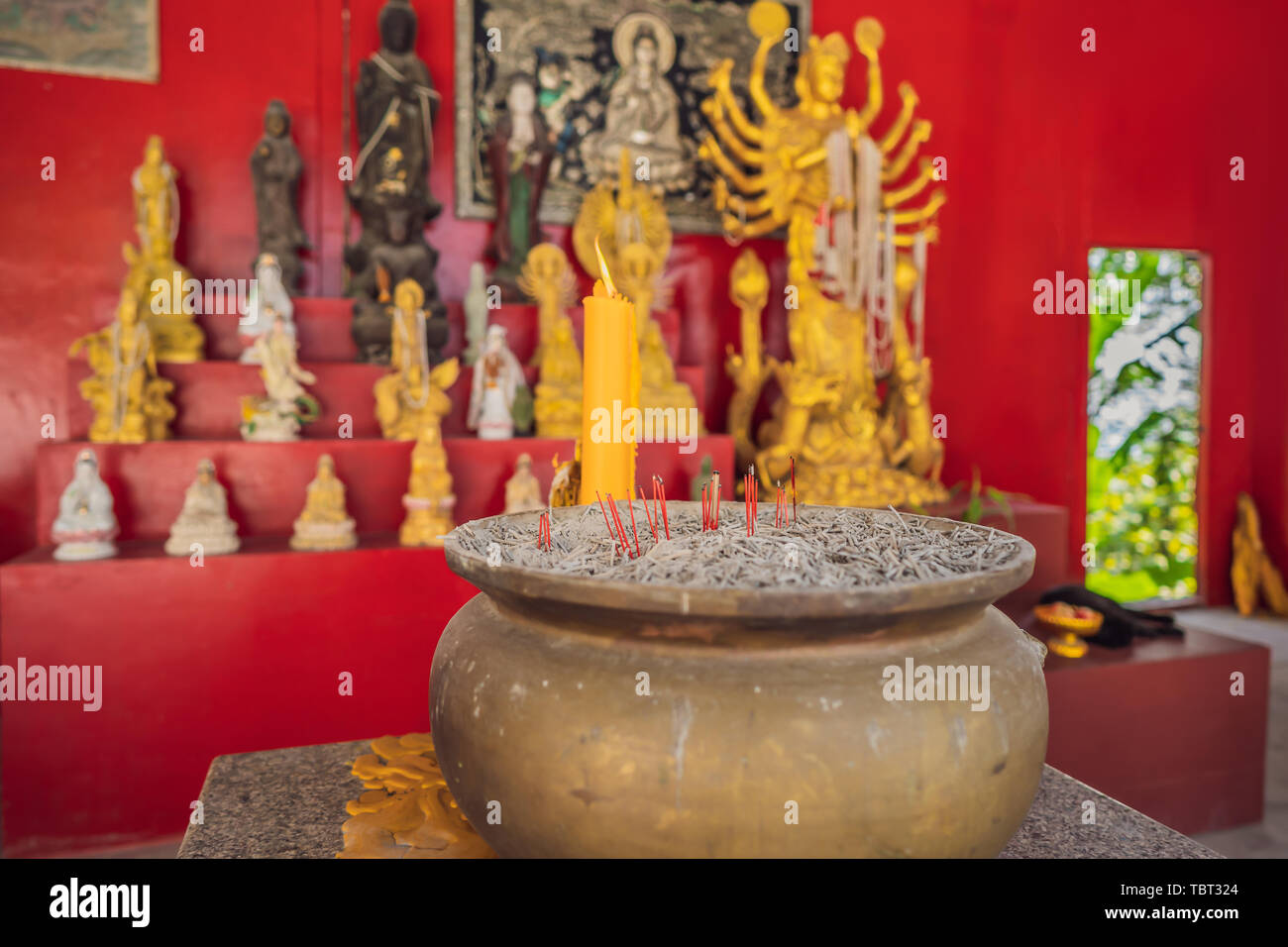 Burning praying with joss stick at Buddhist temple Stock Photo - Alamy