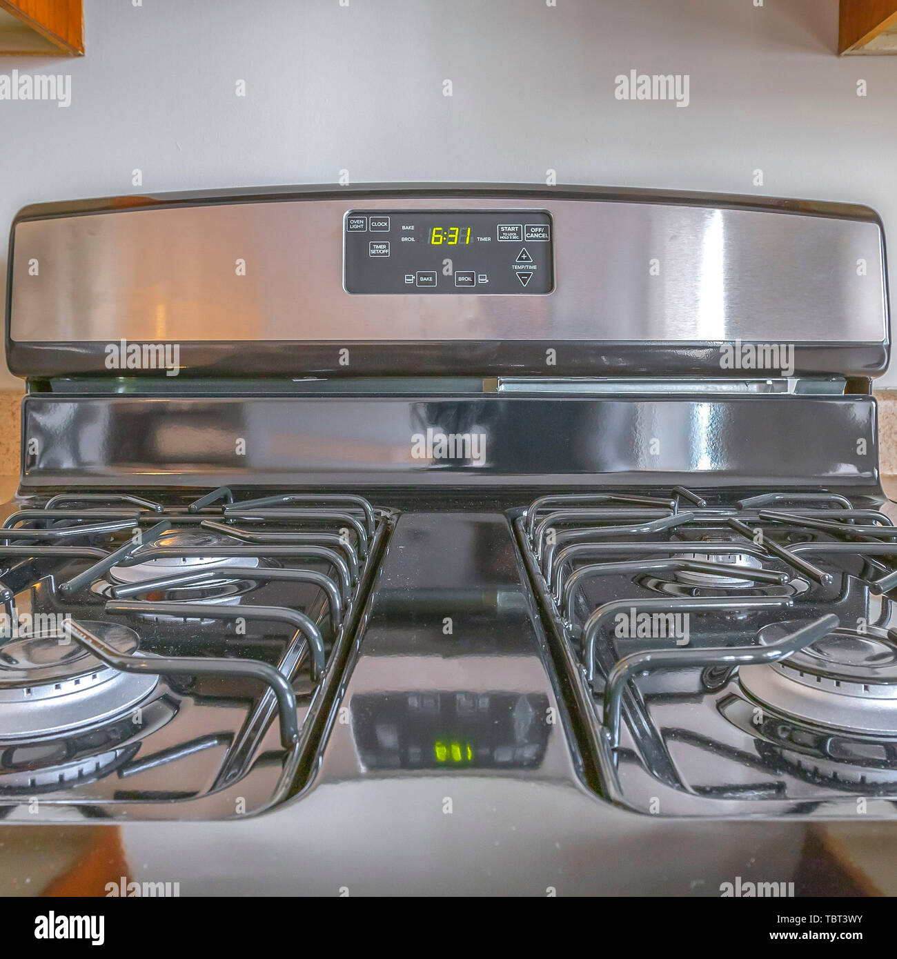 Square Close up of a gas stove with a shiny surface inside the kitchen ...