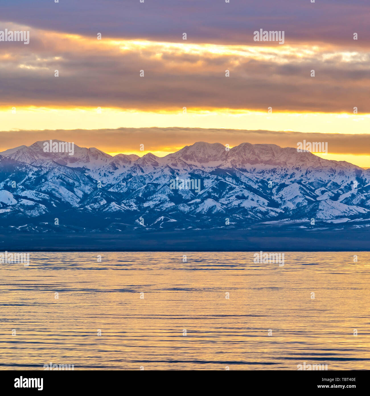 Square frame Panoramic view of a shiny lake and mountain covered with ...