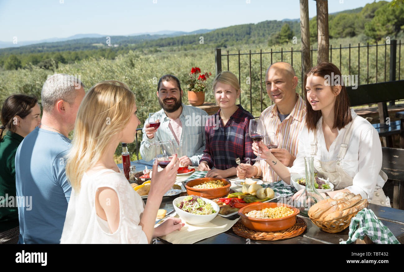 Friends chatting table on terrace hi-res stock photography and images ...