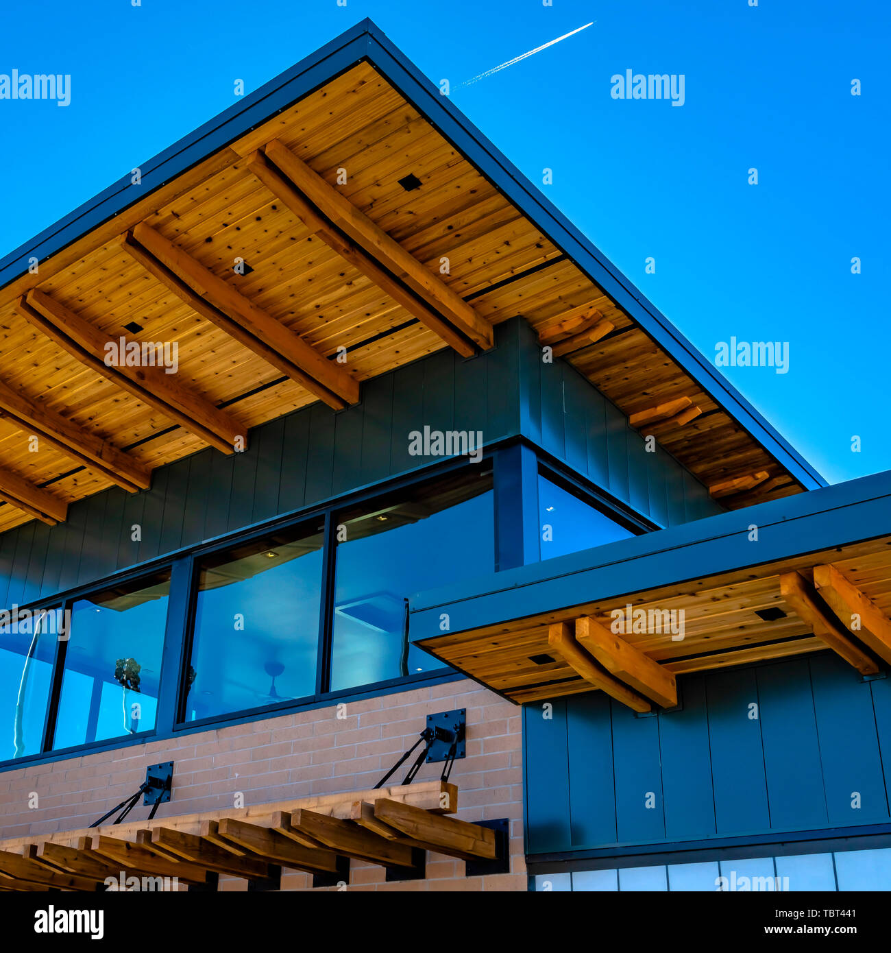 Square Exterior of a commercial building with brick wall and flat roof ...