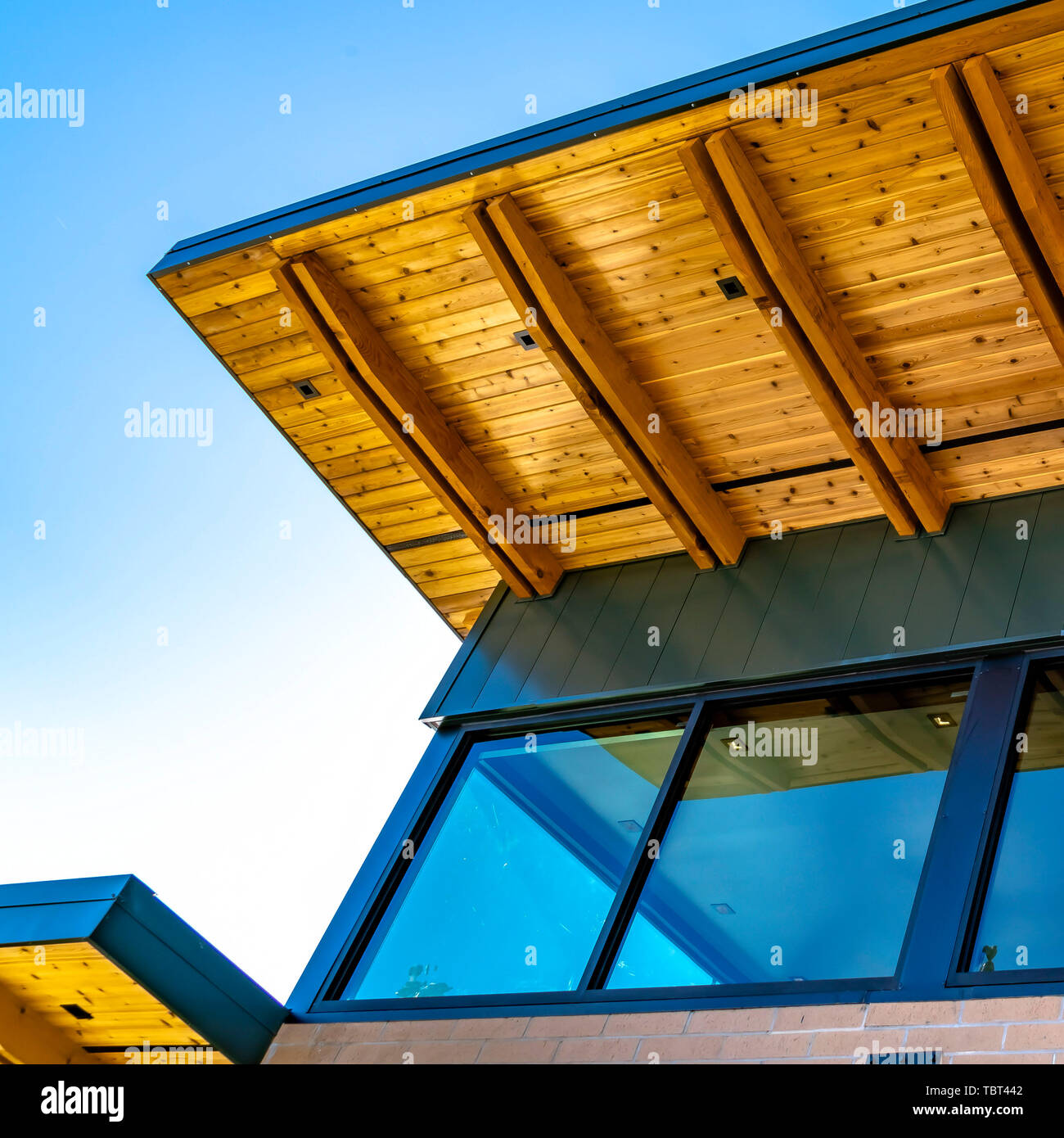 Square frame Exterior of a brick building with view of the large glass ...