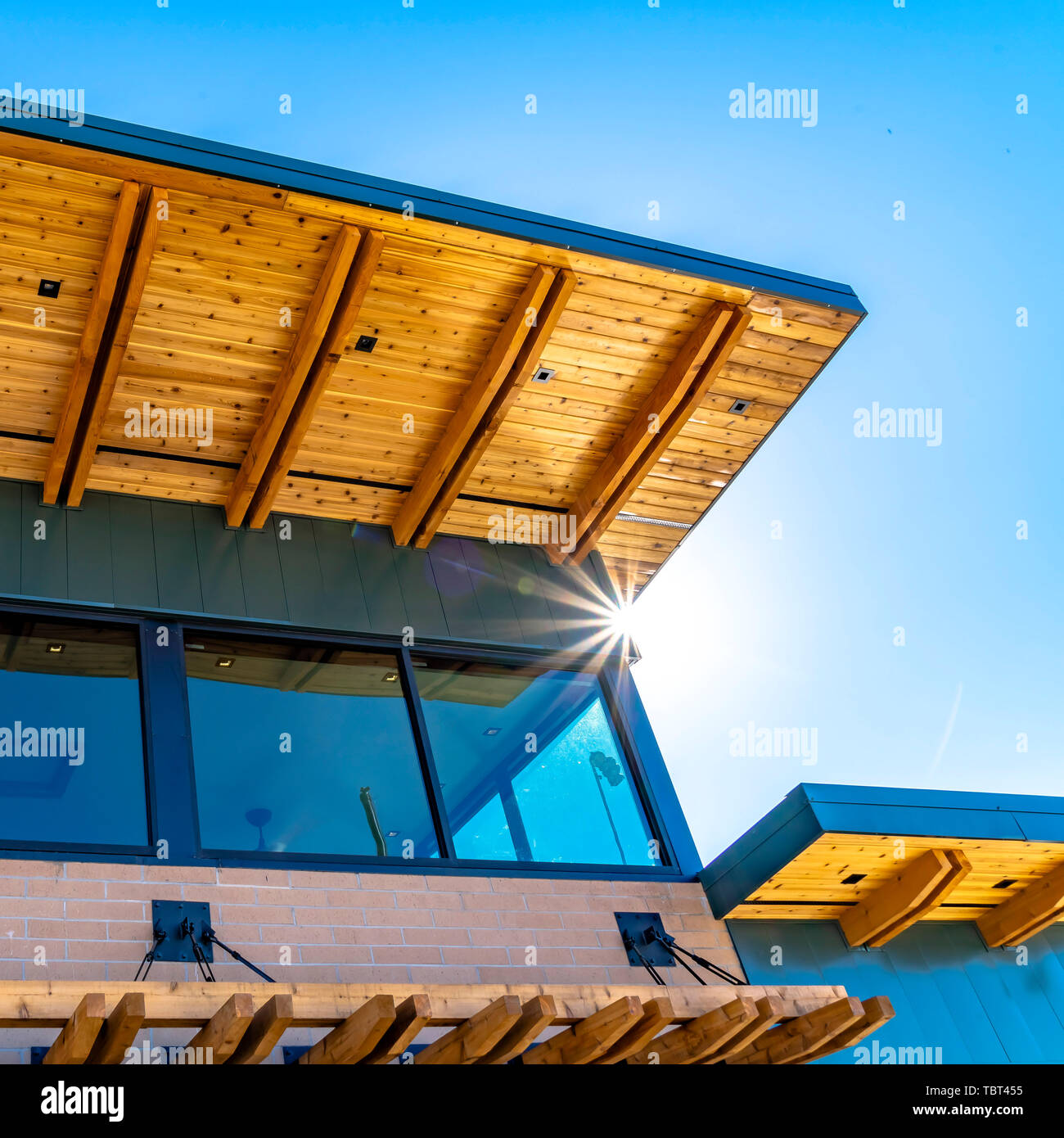 Square Exterior of a building with flat roof and classic red brick wall ...