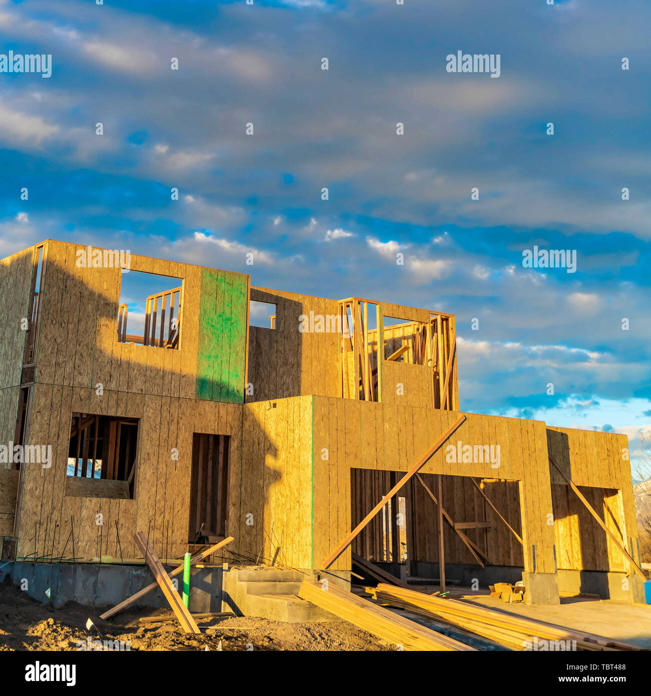 Square Framework of a house under construction viewed on a bright sunny ...