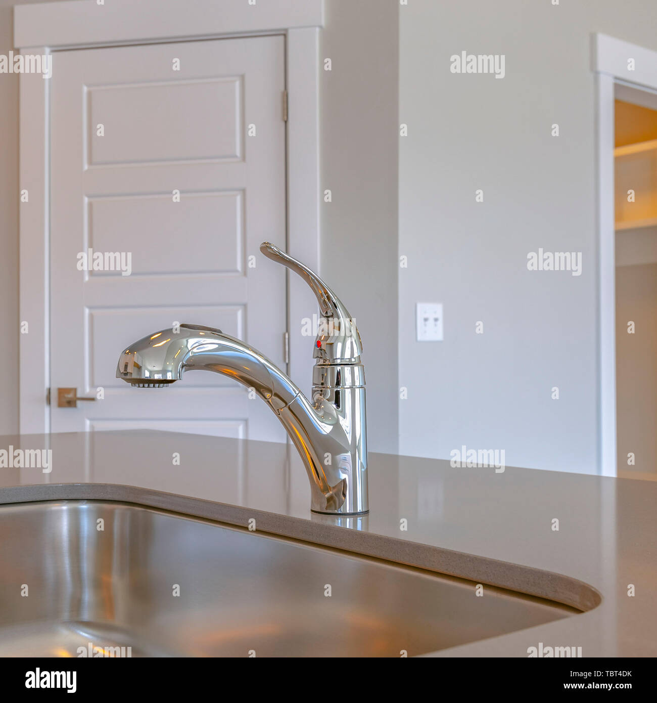 Square frame Shiny stainless steel sink and faucet on the countertop ...