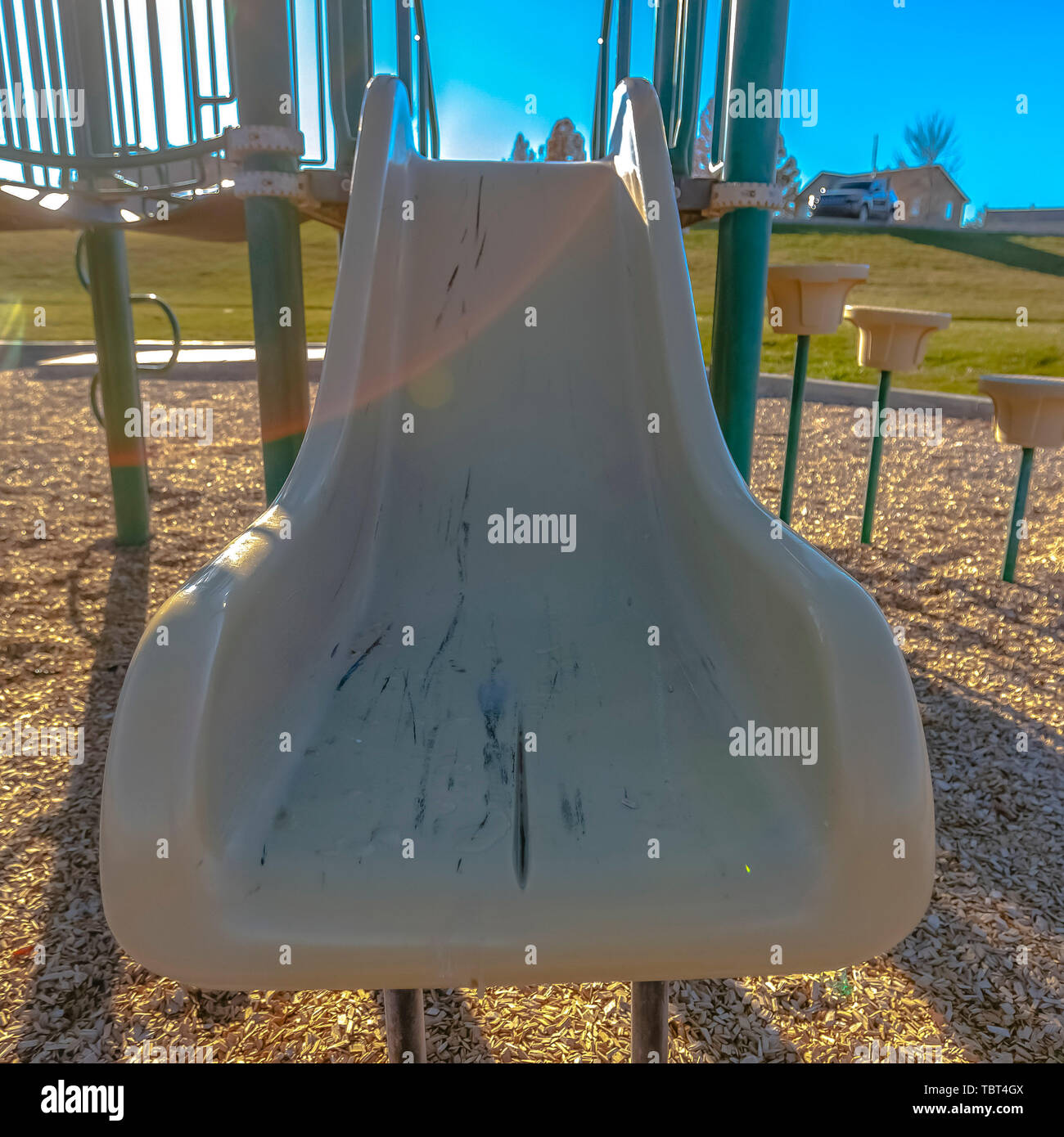 Square Slide on a playground with the sun shining brightly in the ...