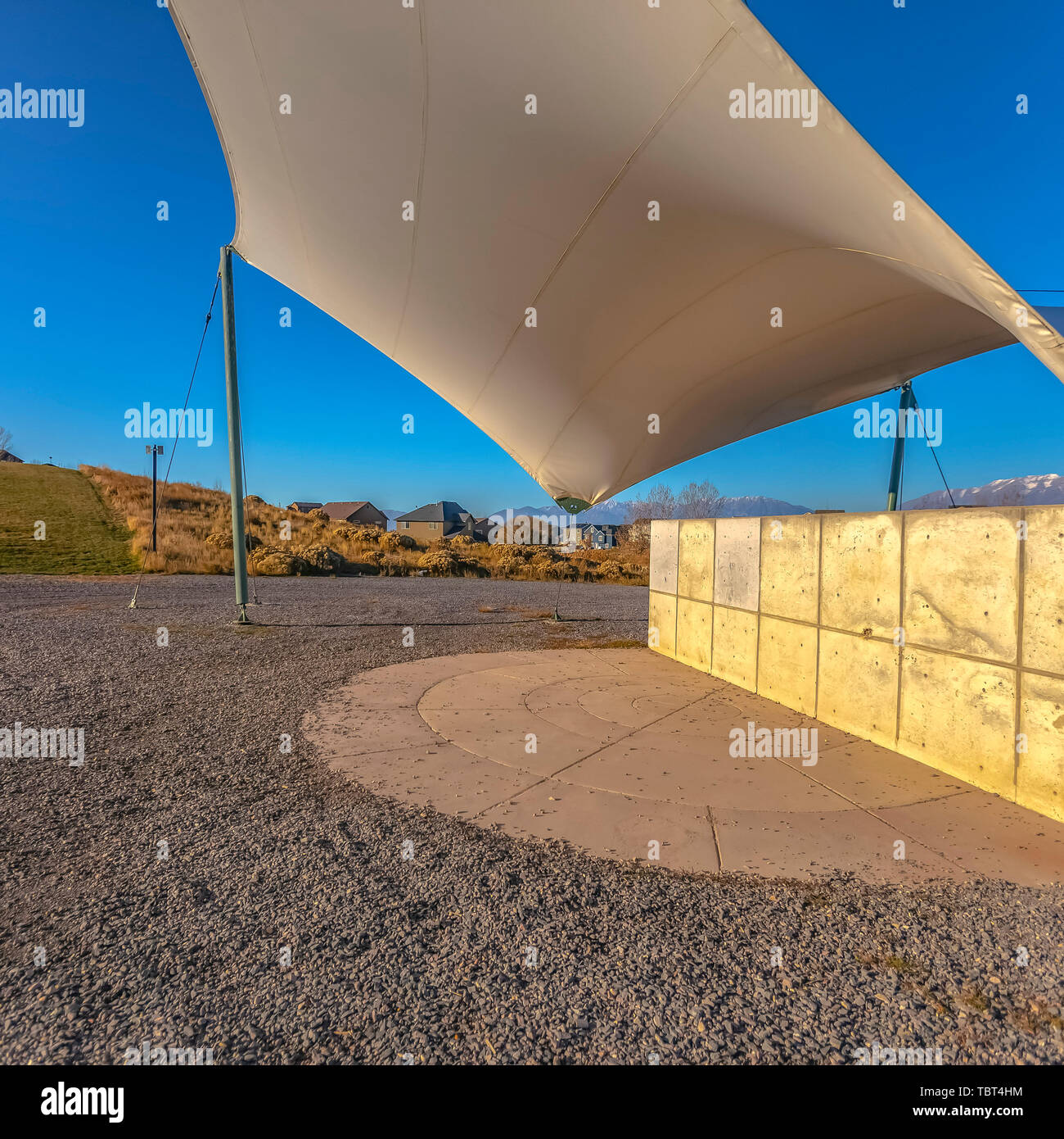 Square frame Concrete rectangular structure on a rocky ground under a ...