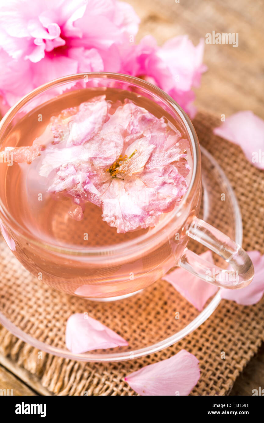 Cherry blossom tea, cup of fresh pink cherry blossom tea and cherry ...