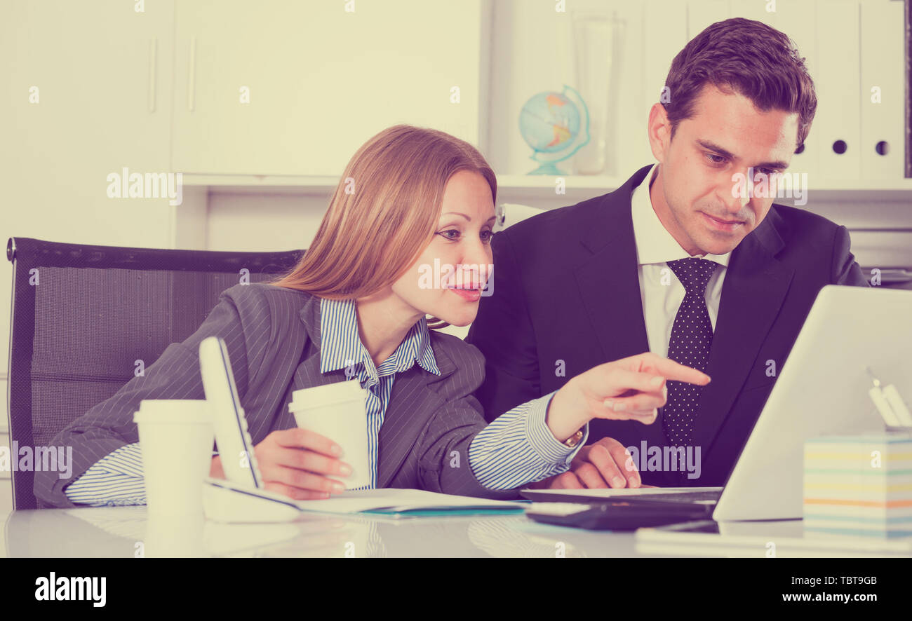 Focused business team working with computer in modern office Stock ...