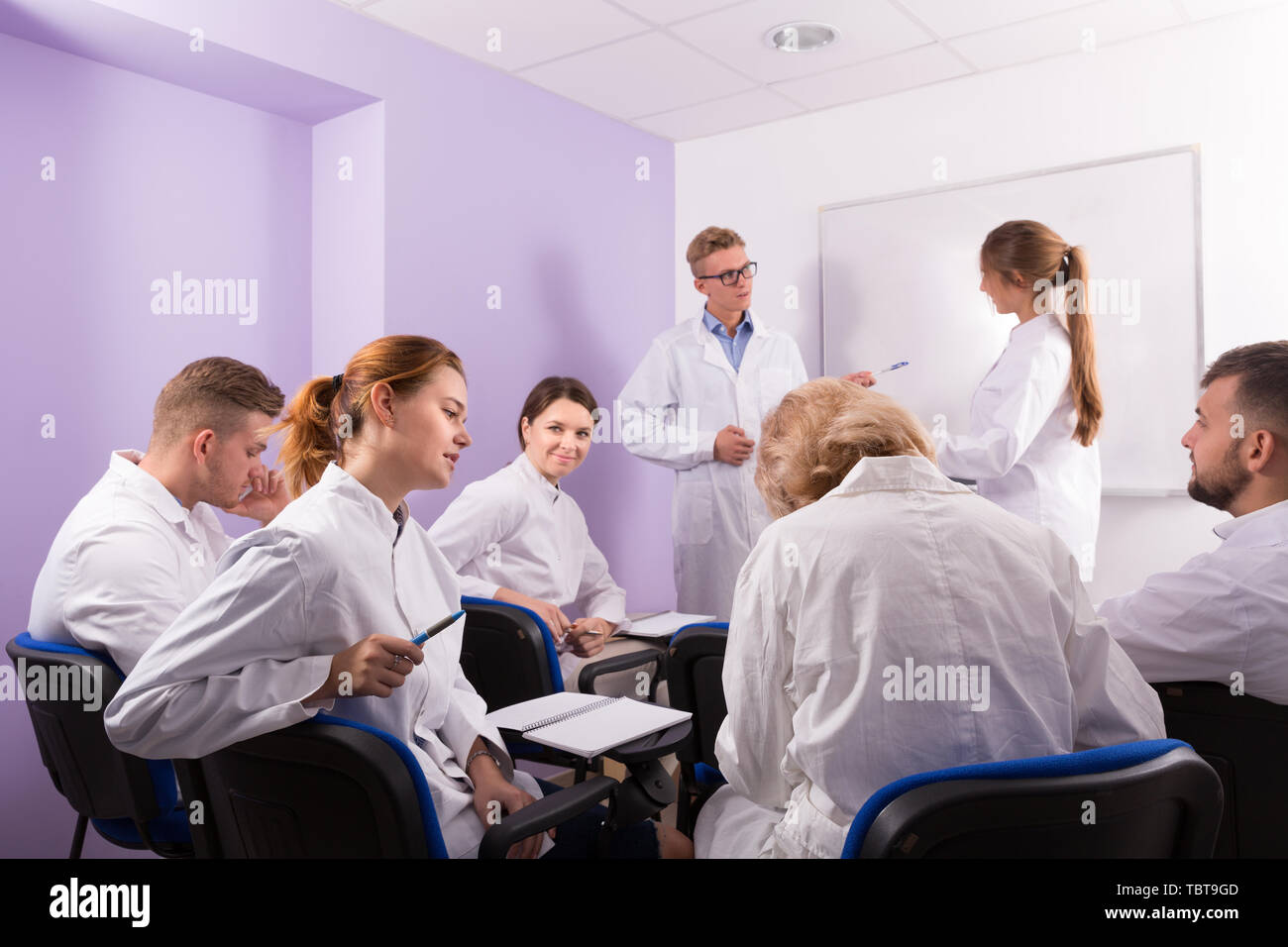 Young students of medical faculty conversation with teacher and with ...