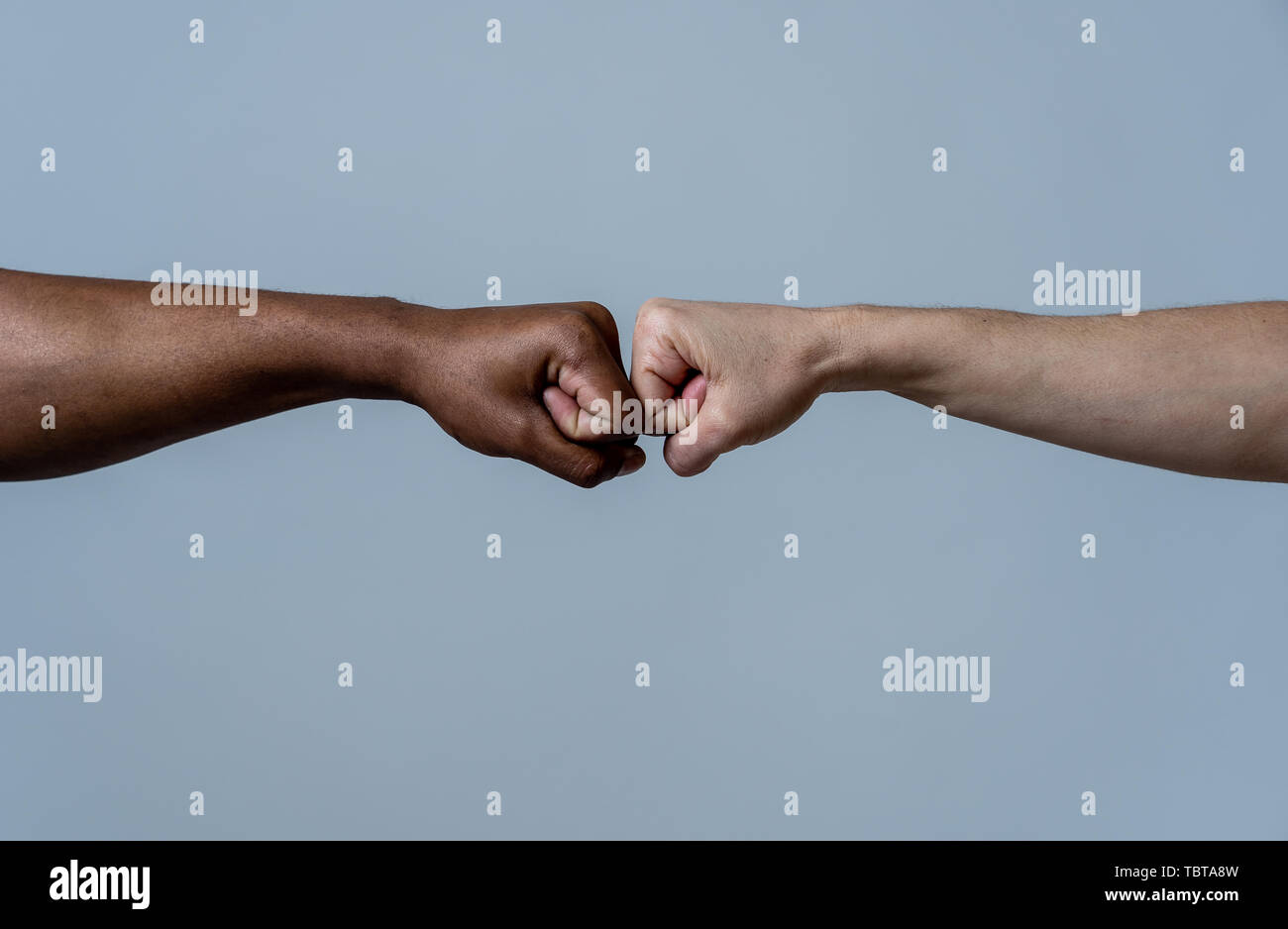 Black African American race male and white Caucasian woman hands giving ...