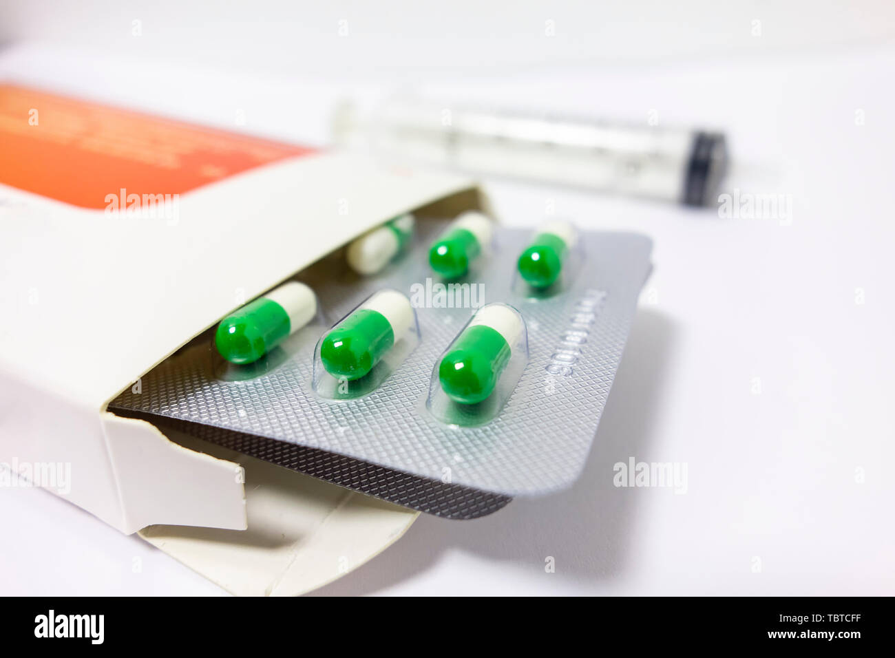 Medical drugs laid in white background Stock Photo - Alamy