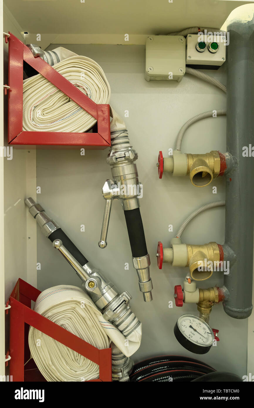 Fire shield. Fire hoses, fire hydrants fire hoses Stock Photo - Alamy