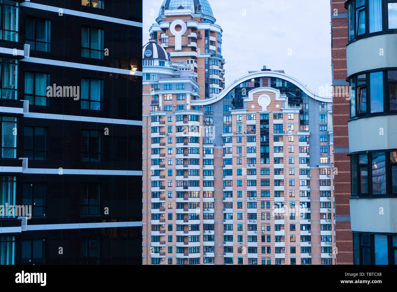 Fragments of beautiful modern buildings in the late evening against the ...