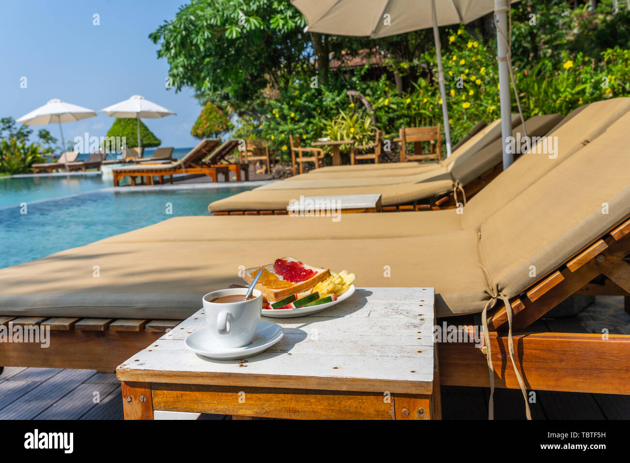 Coffee and sandwiches for breakfast on the pool in resort Stock Photo ...