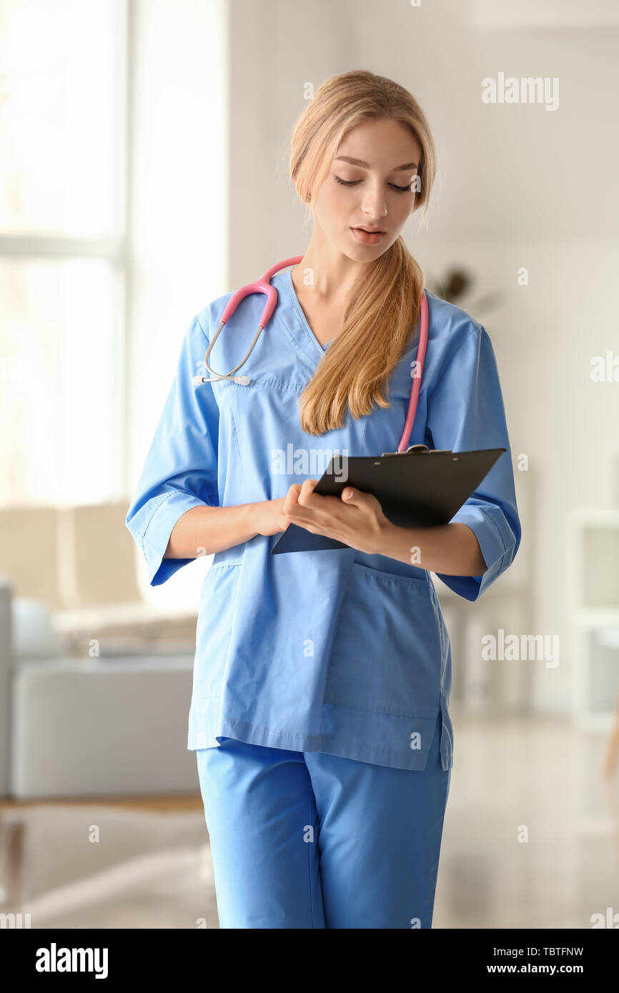 Female medical assistant in clinic Stock Photo - Alamy