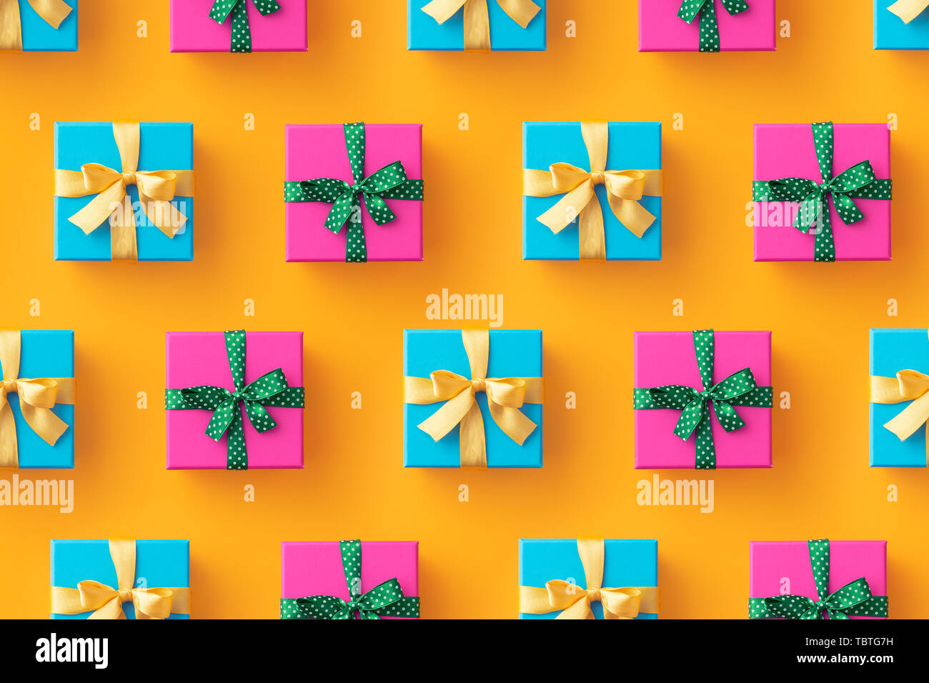 Multiple gift boxes organized over yellow background, top view Stock ...