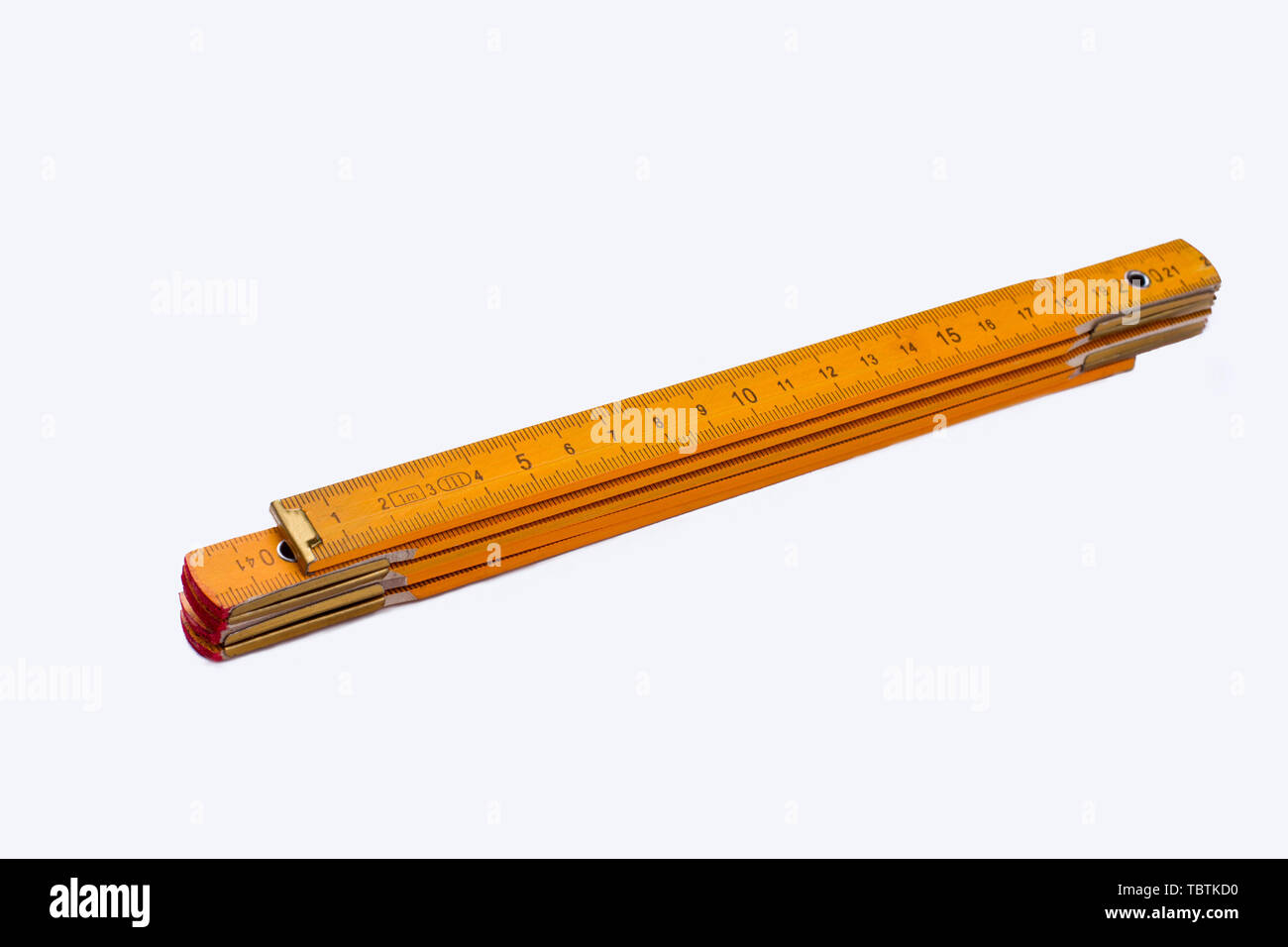 Folding ruler isolated. Yellow carpenters ruler with centimeters ...