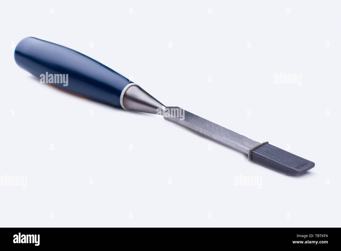 Metal tool isolated on white background. Chisel with rubber handle ...